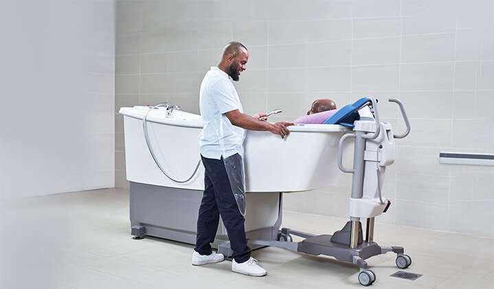 Symbliss® Bath - An Ergonomic Spa-Like Bathing System | Arjo